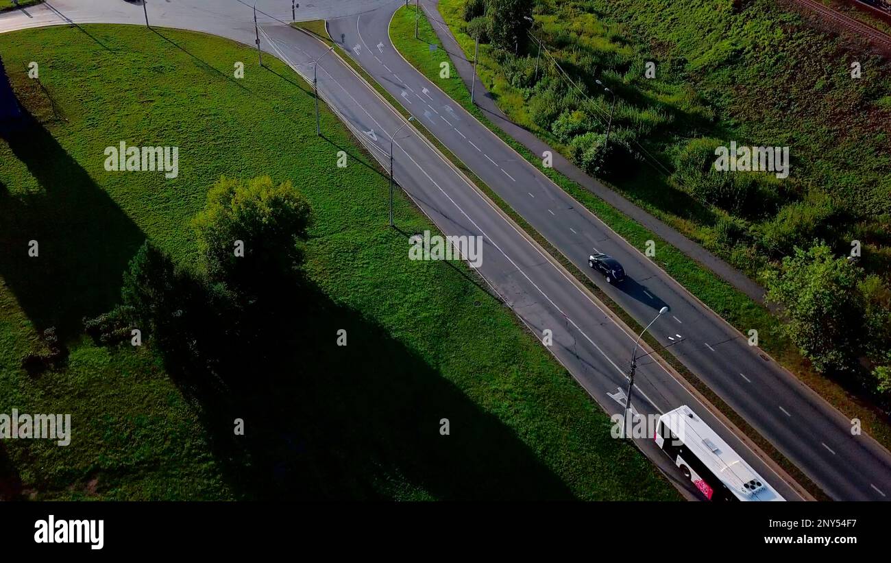Movement of cars on the road near parks. Clip.A view of the road with ...