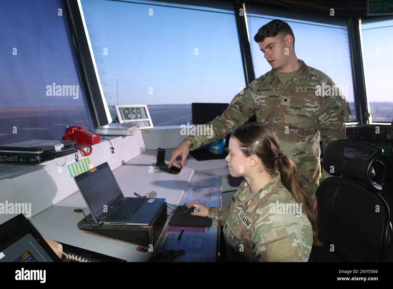 U.S. Army Spc. Isaac Bernardy (standing) and Spc. Haley McMurray, both ...