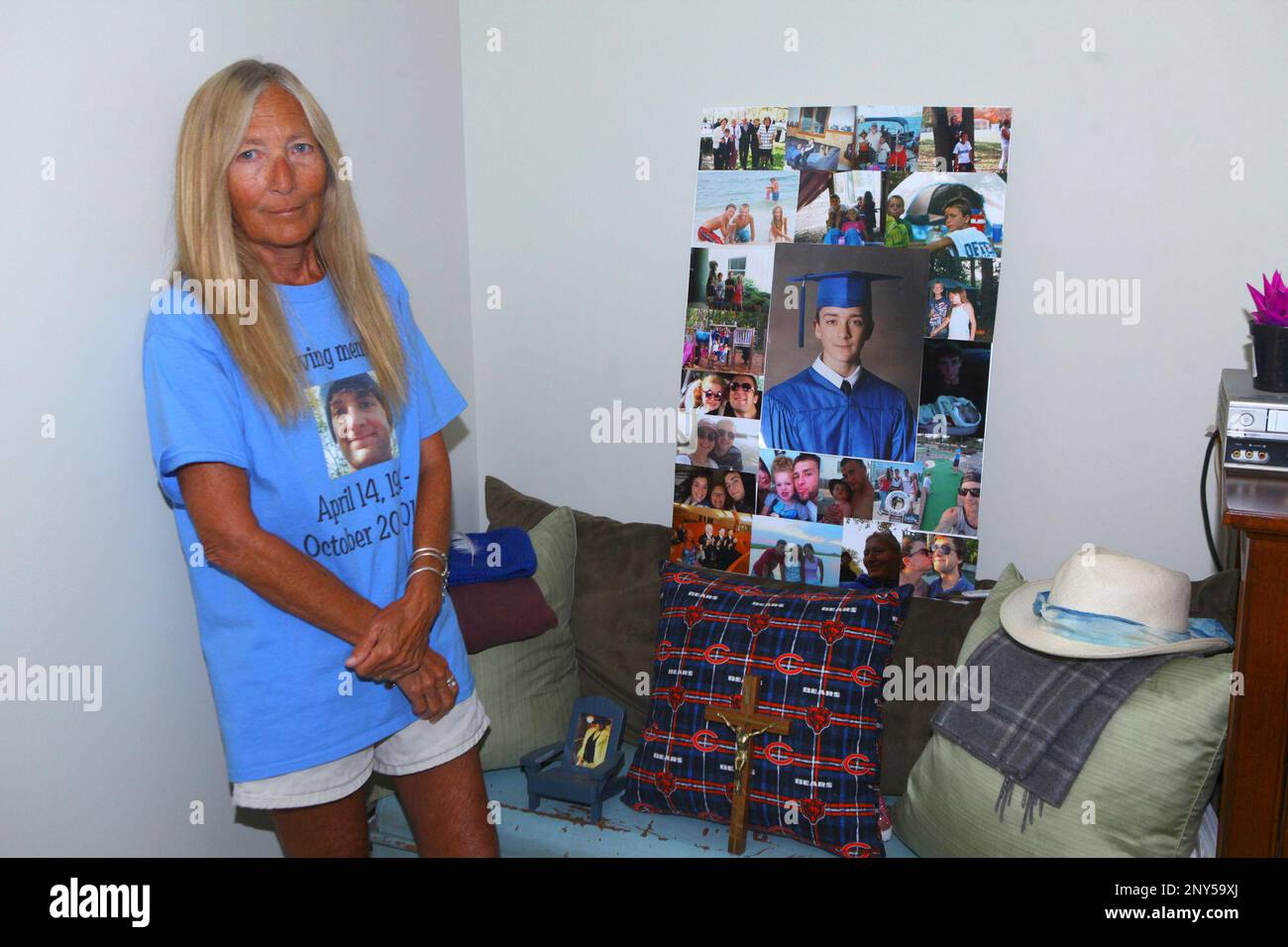 Kate Garrity, of Chesterton, poses with photos of her son, Patrick, in ...