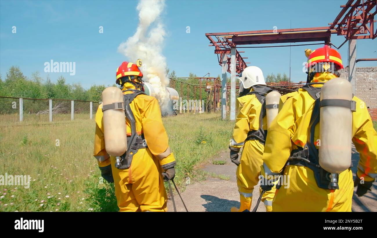 Firefighters and smoking train. Clip. Firefighters at scene of fire and ...