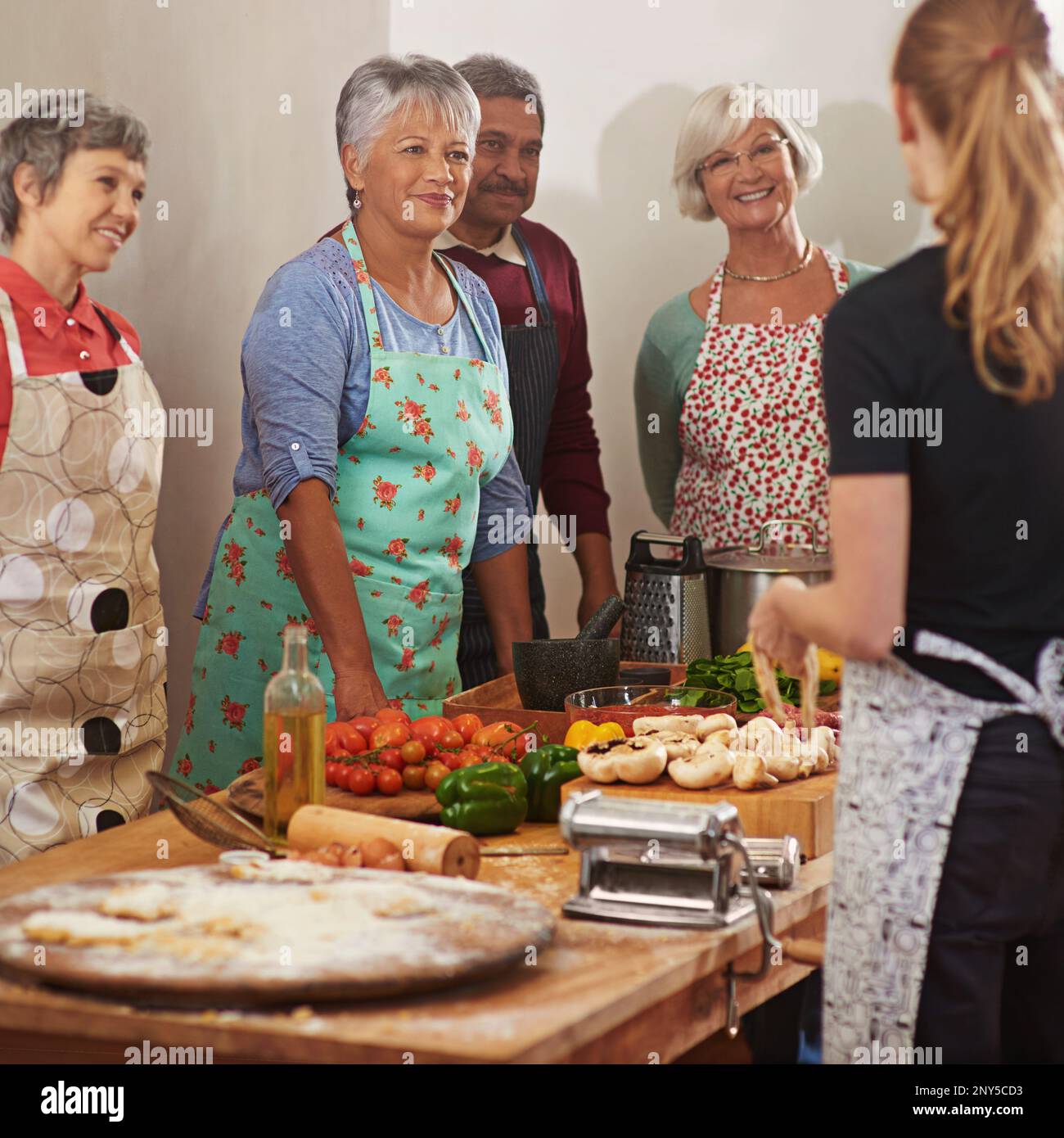 Youre never too old to learn. a group of seniors attending a cooking ...