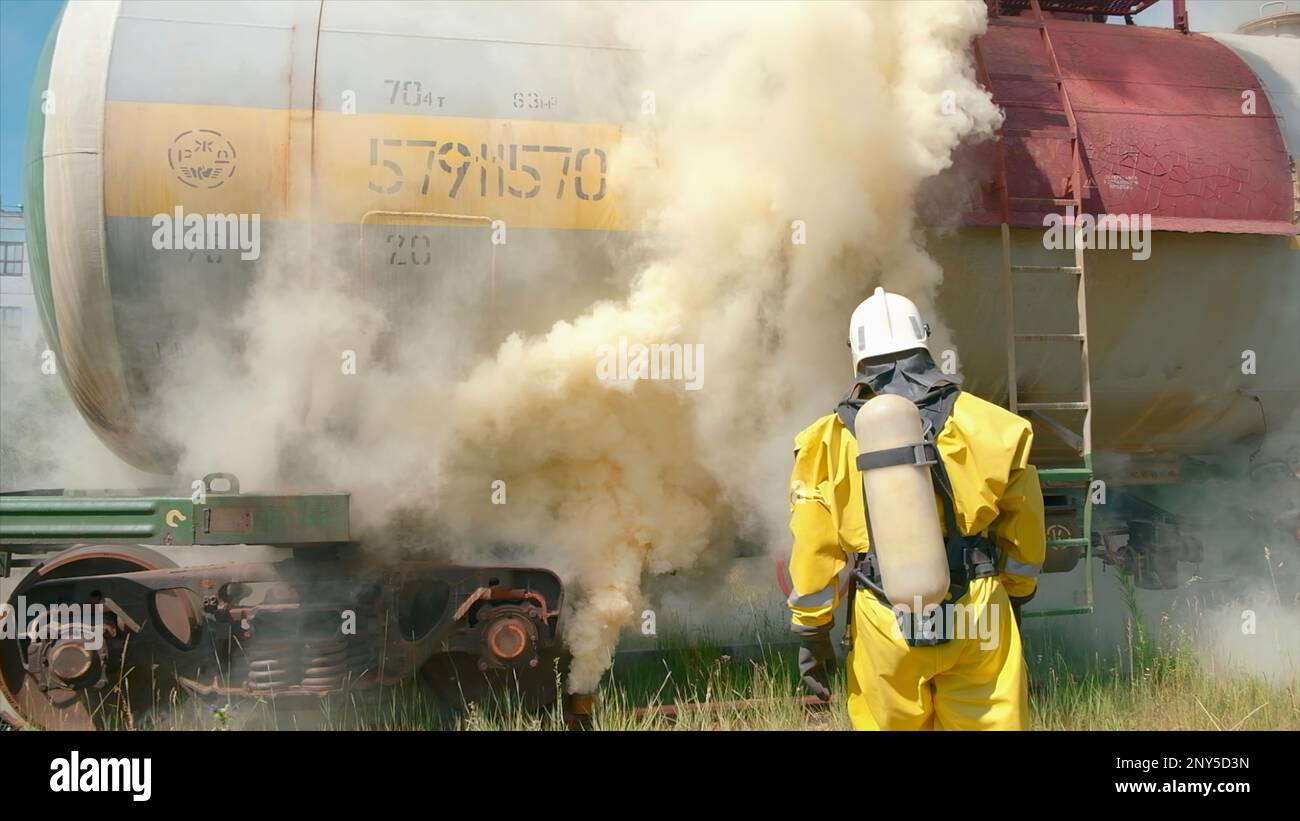 Firefighters and smoking train. Clip. Firefighters at scene of fire and ...