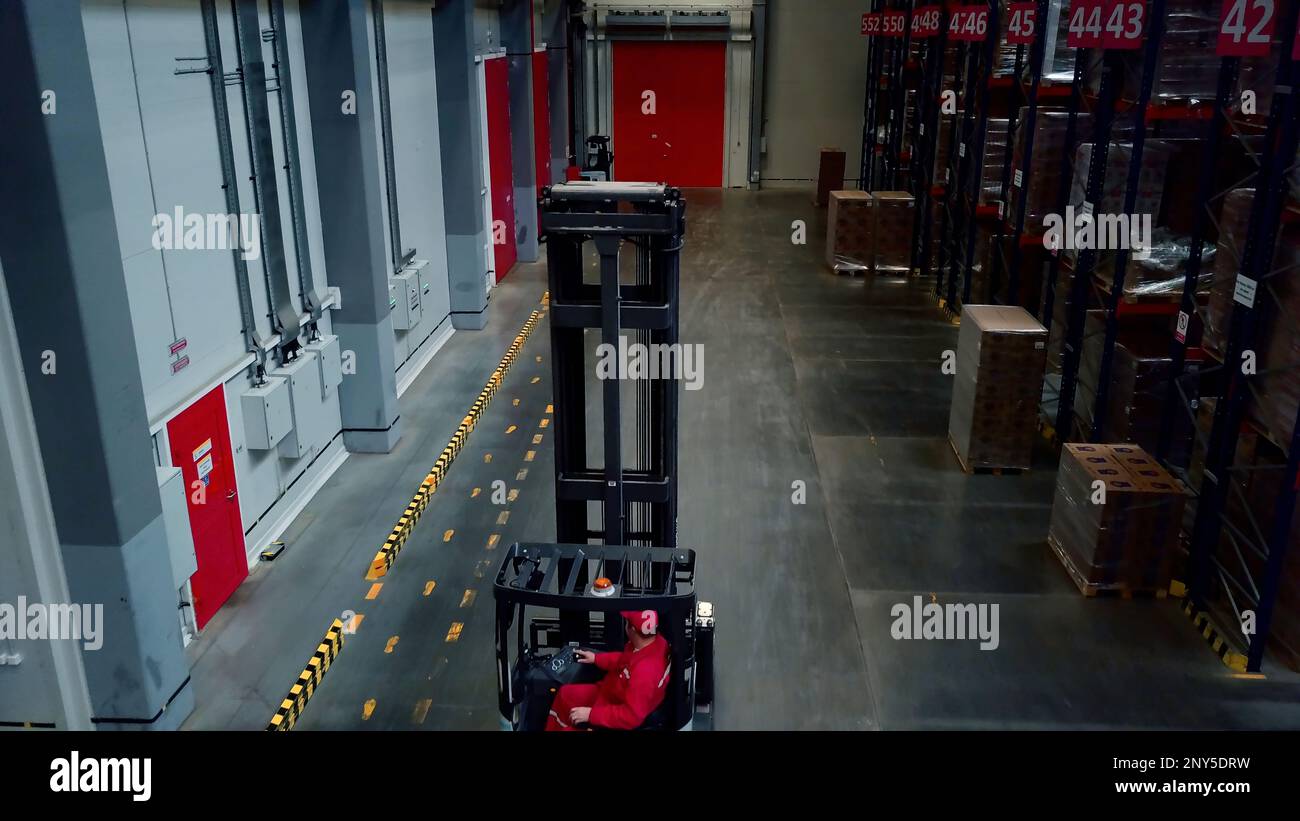 Continuous flow of work in the warehouse. Creative. Running people with ...