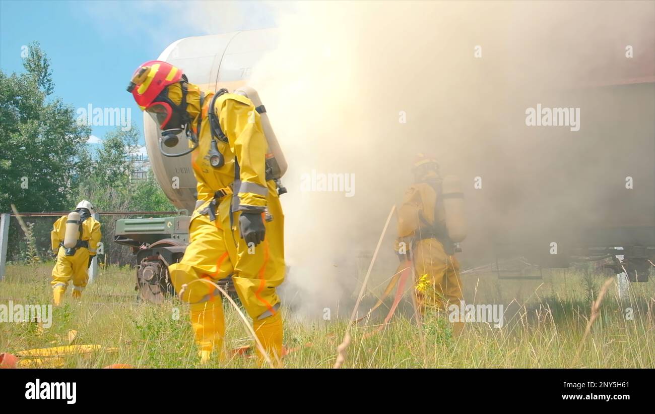 Firefighters and burning train. Clip. Firefighters are preparing with ...