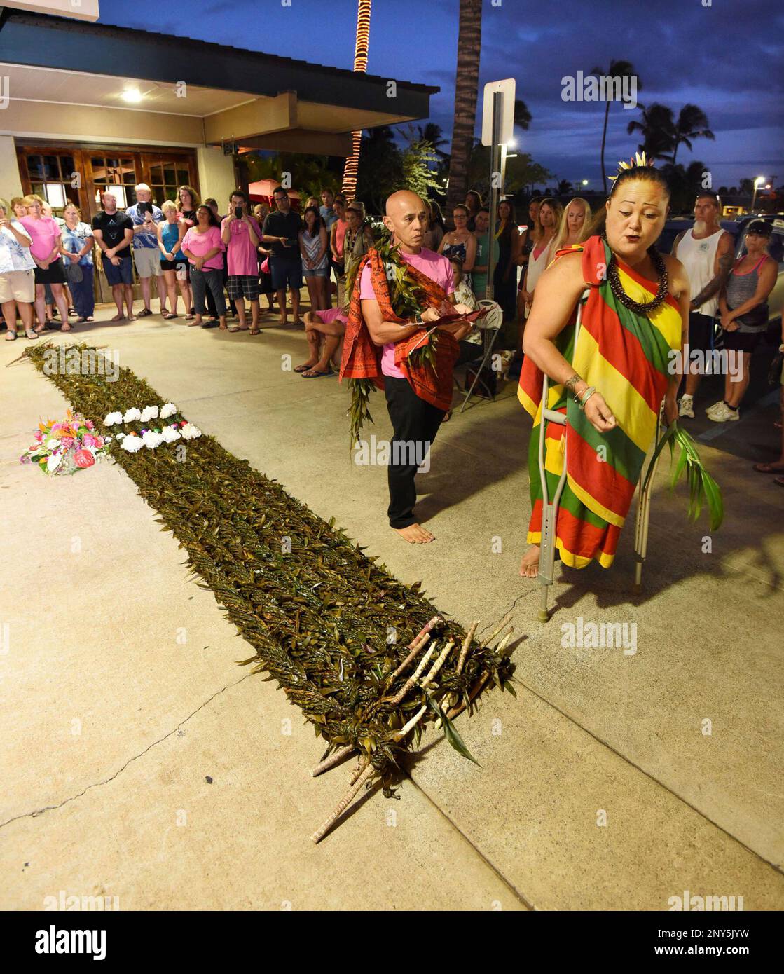 Lehua Kekahuna, followed by Joe Tolbe, left, chants a Hawaiian blessing ...