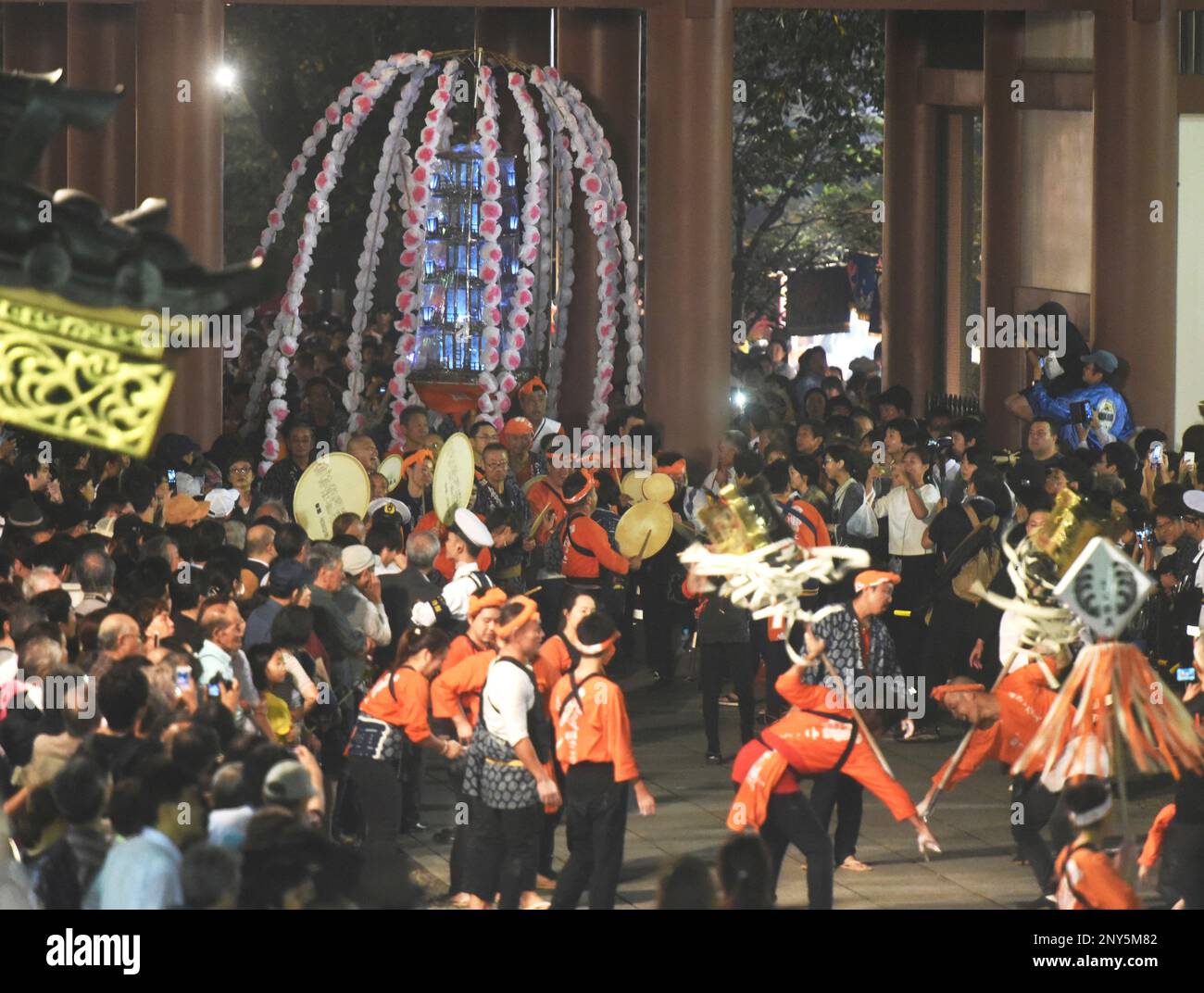 Participants march to Ikegami Honganji temple carrying Mando, a lighted ...