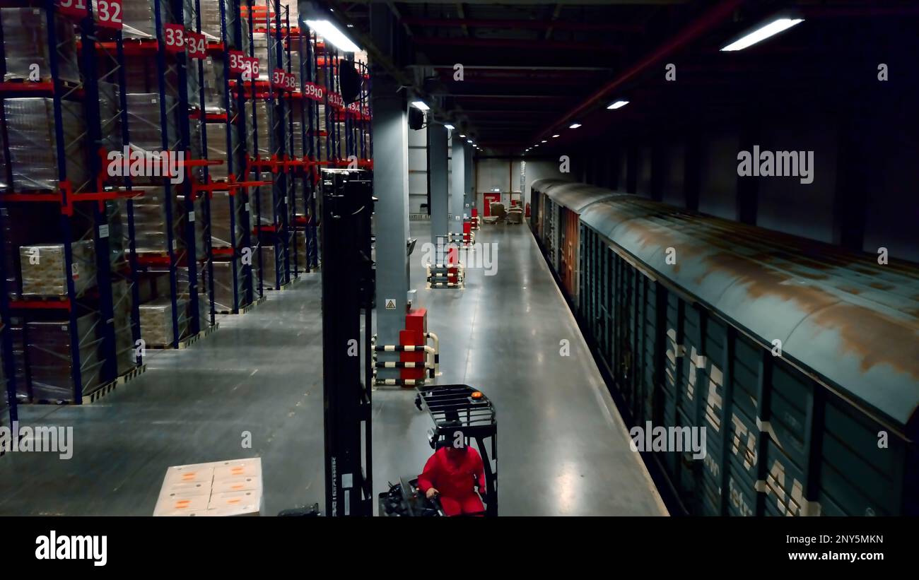 Unloading of freight trains. Creative. Parked wagons with goods in the ...