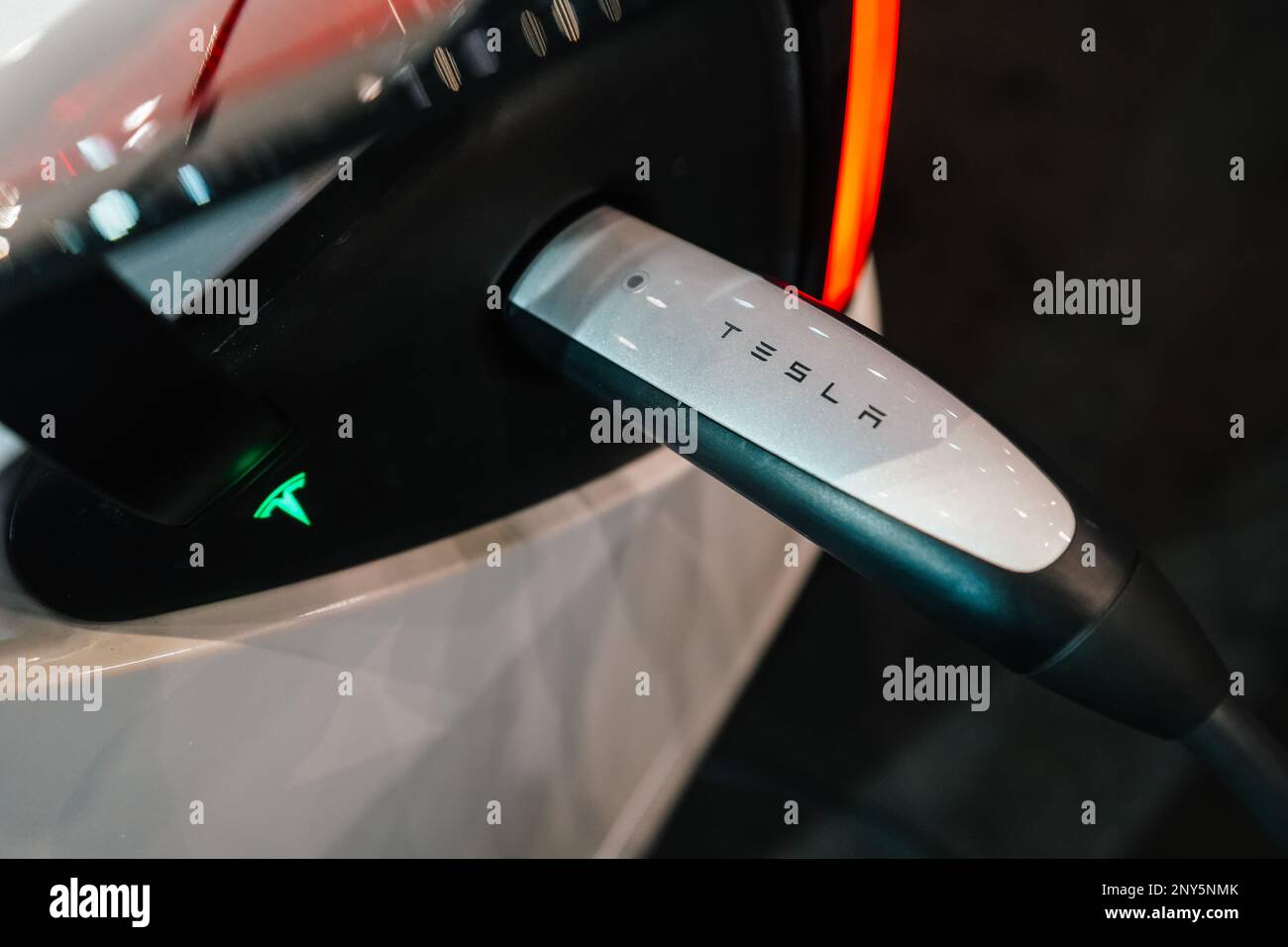 Tesla charging station in the showroom Stock Photo - Alamy