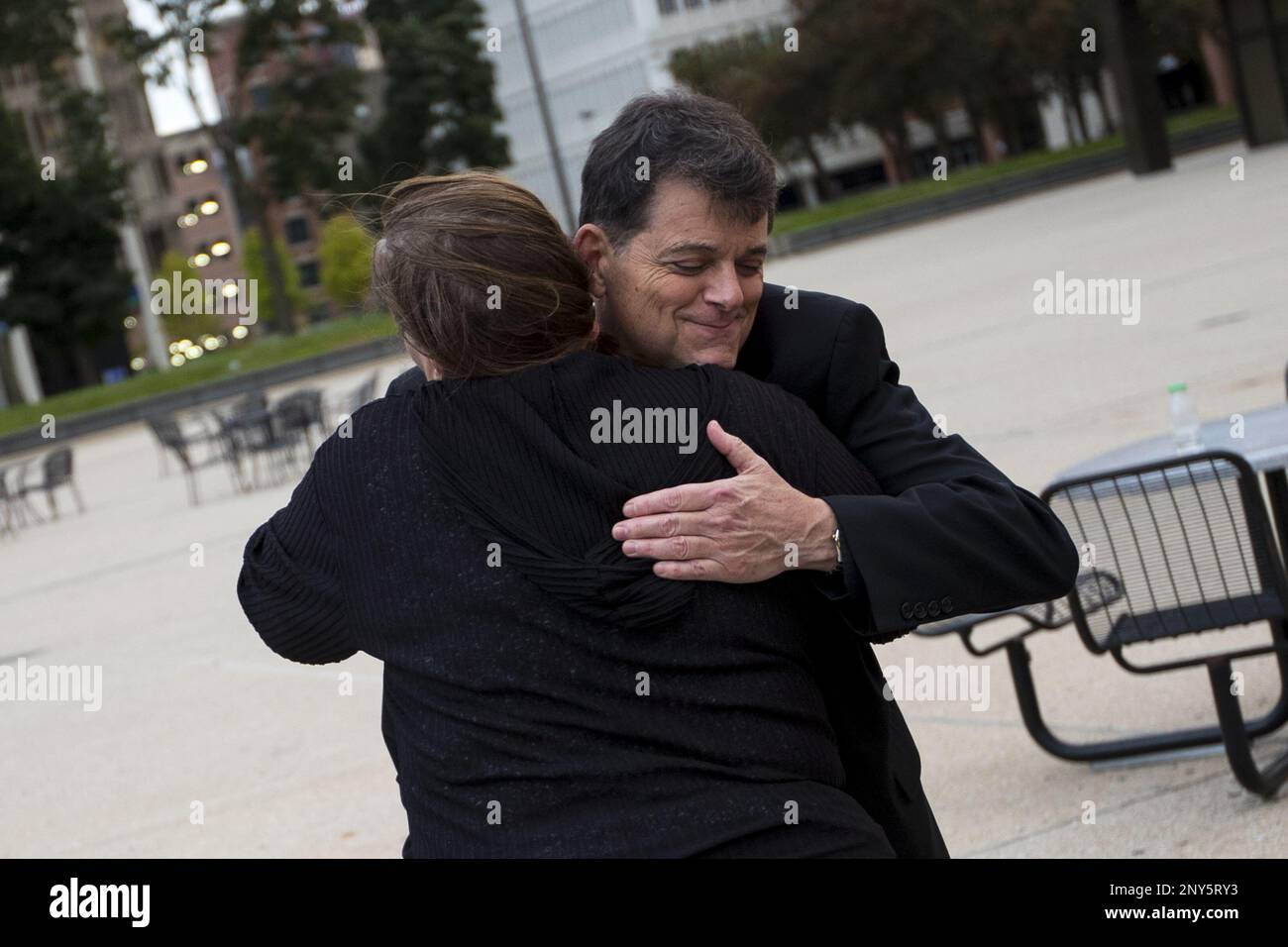 Rev. Dr. Christian Brocato from St. Mark's Church hugs Cherie Wells ...