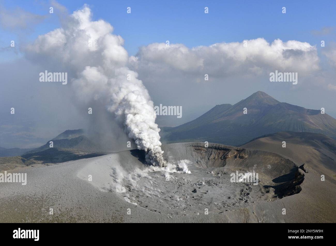 Volcanic smoke rises from the Shinmoedake volcano after its eruption in ...