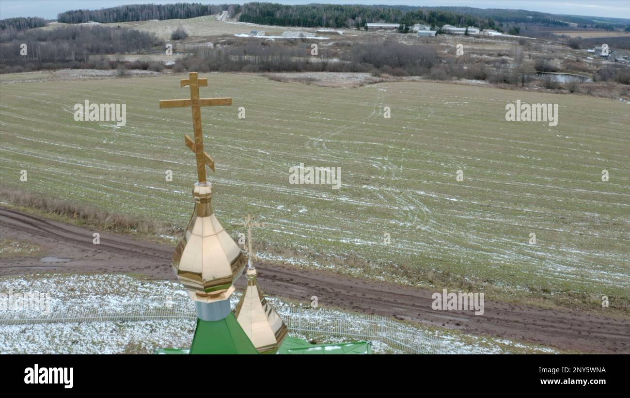 Top view of church cross on background of village fields. Clip. Village ...