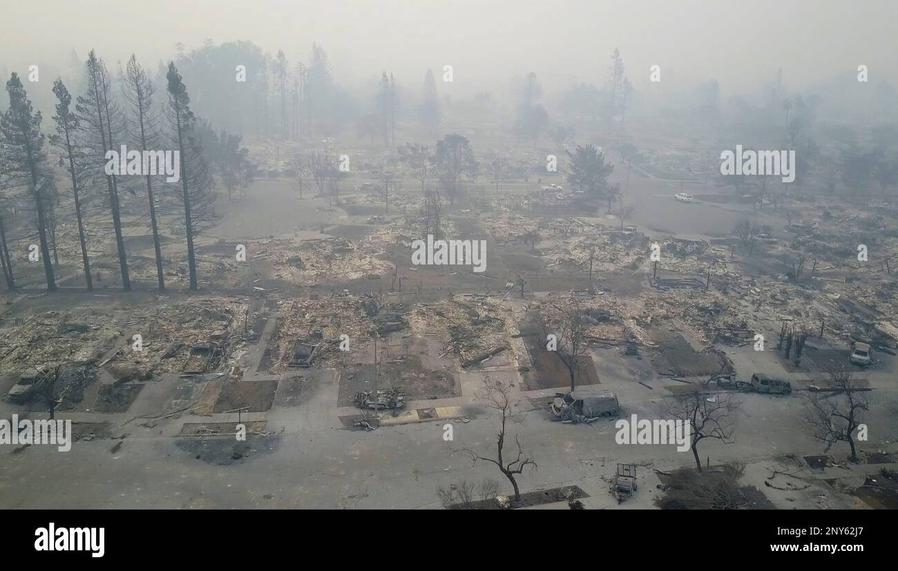 This aerial image shows a neighborhood that was destroyed by a wildfire ...