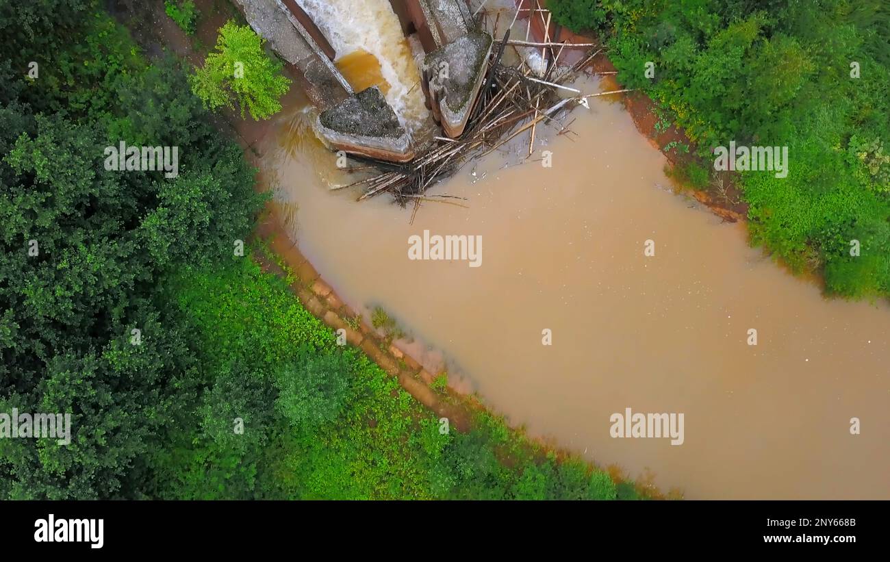Top view of dam on dirty river. Clip. Industrial dam on dirty river ...