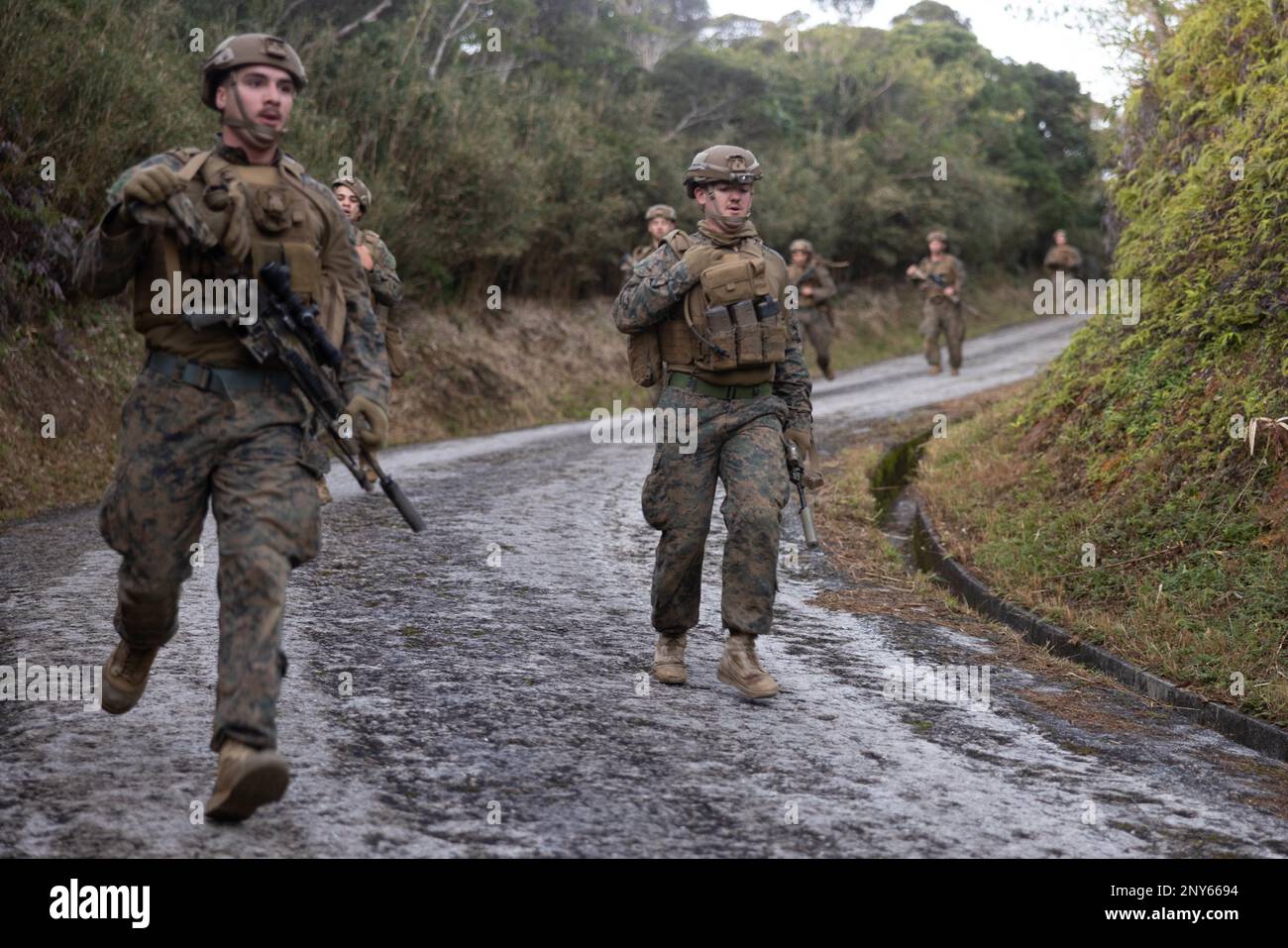 U.S. Marines with 3d Marine Division complete a tactical movement ...
