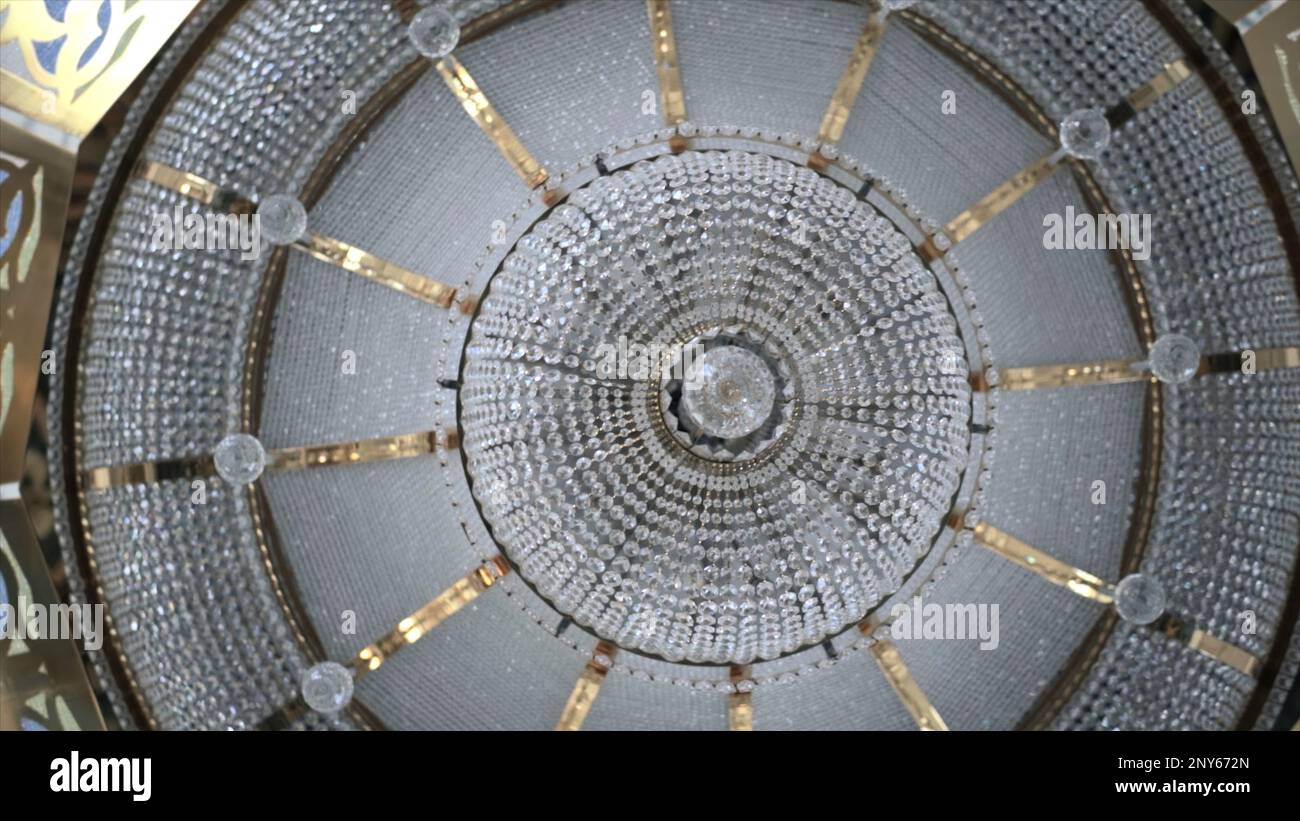 Crystal chandelier in temple. Scene. Beautiful light of crystal ...