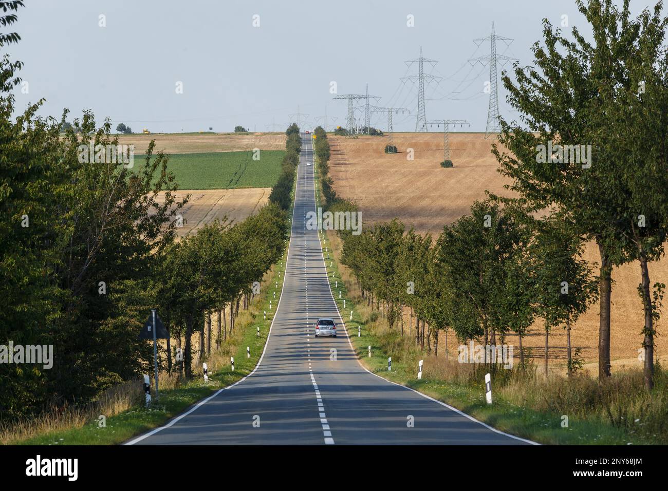 Country road straight routing Stock Photo - Alamy