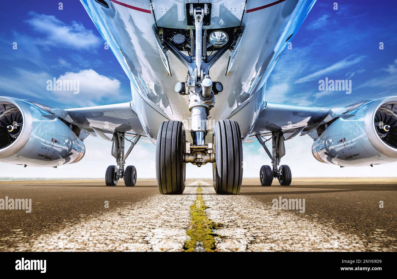 aircraft on a runway waiting for take off Stock Photo - Alamy