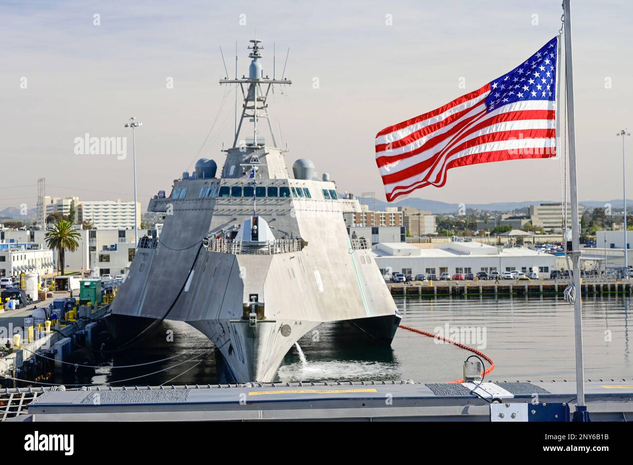 The U.S. flag flies aboard the Independence-class littoral combat ship ...