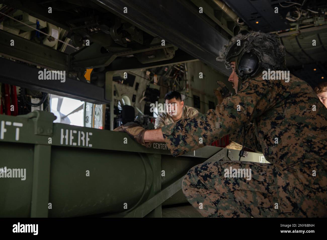 A Marine assigned to the 3rd Marine Expeditionary Force loads an ammo ...