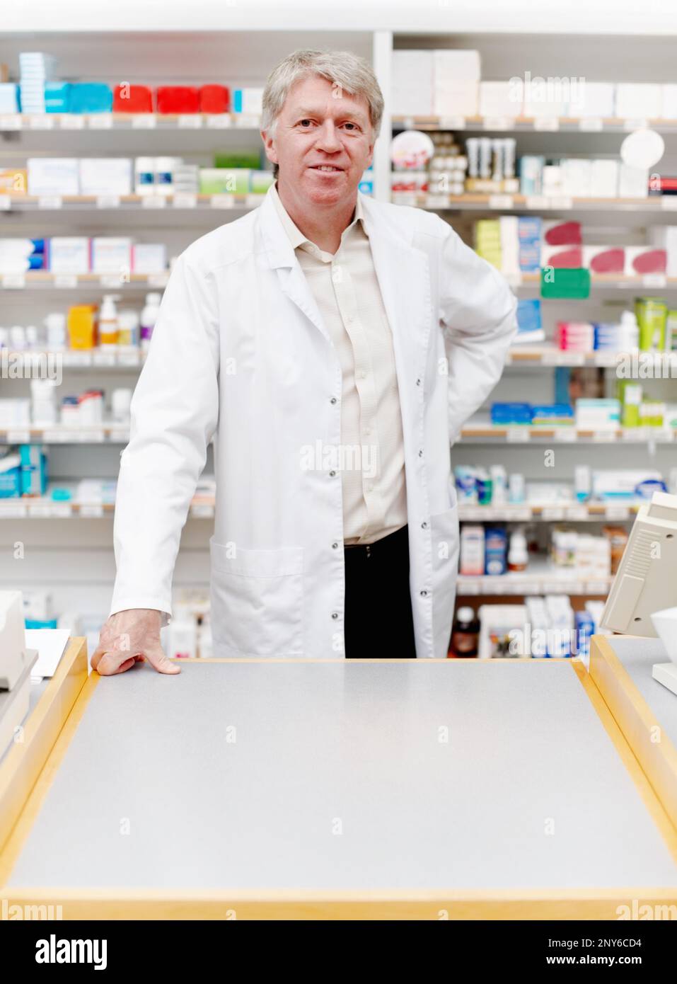 Smart pharmacist at medical counter. Portrait of smart pharmacist ...