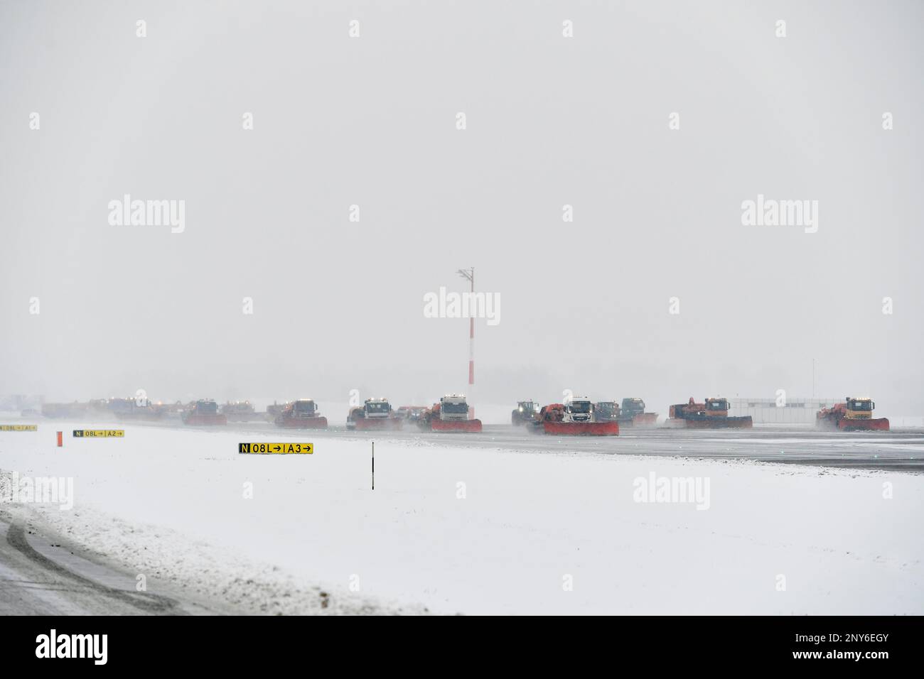 Road sweepers and snow ploughs clear snow on the taxiways and Runway ...