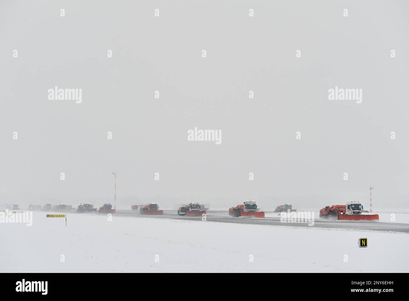 Road sweepers and snow ploughs clear snow on the taxiways and Runway ...