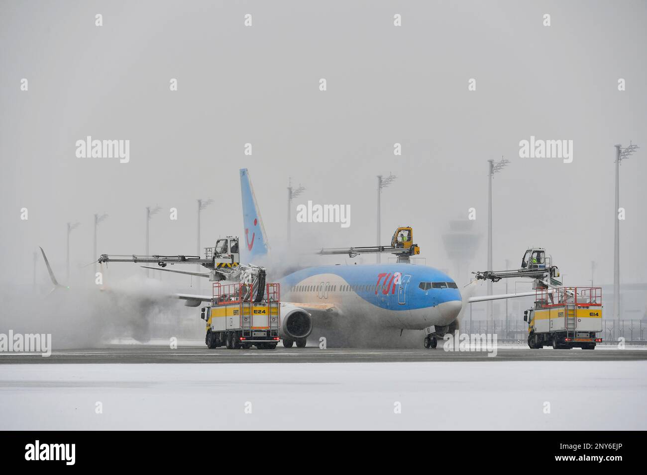 Aircraft deicing in winter in front of take-off, TUI, Boeing, B737-800 ...