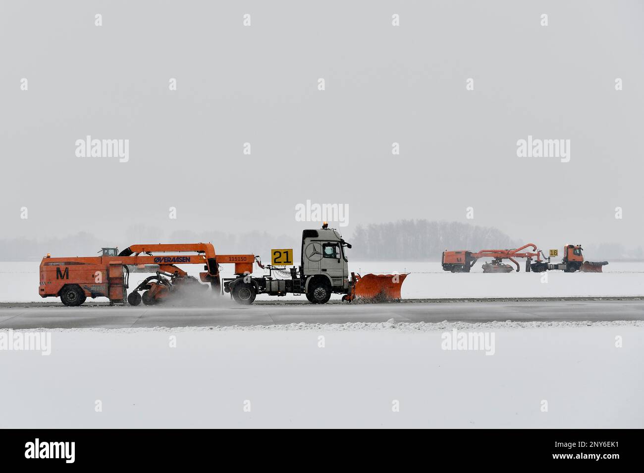 Road sweepers and snow ploughs clear snow on the taxiways and Runway ...