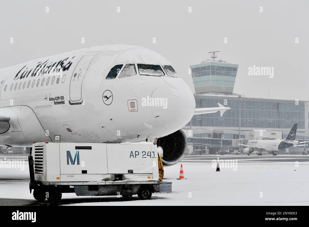 Snowed-in Lufthansa Airbus in winter, A319-100 with power generator ...