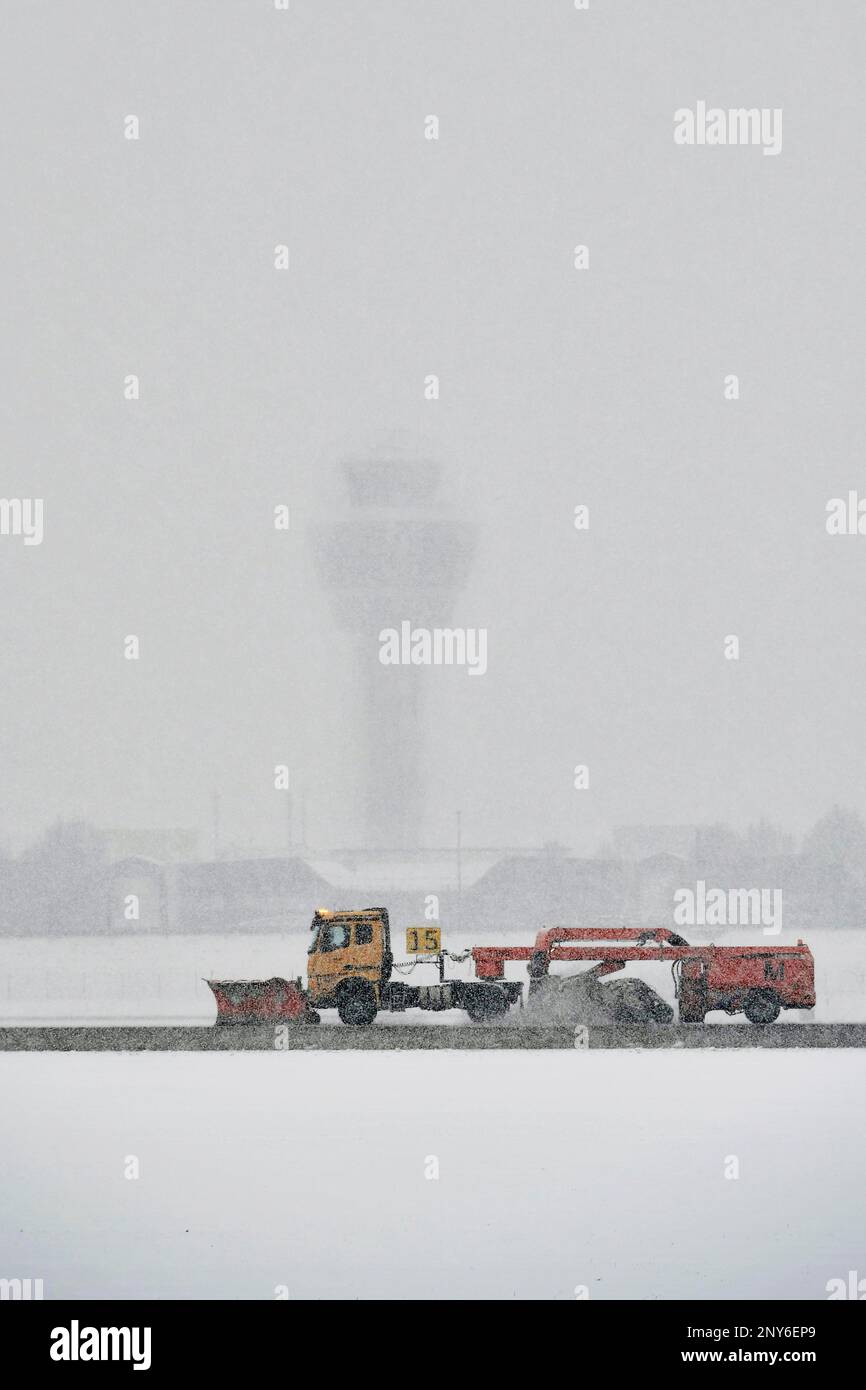 Sweepers clear snow on the southern runway, Munich Airport, Upper ...