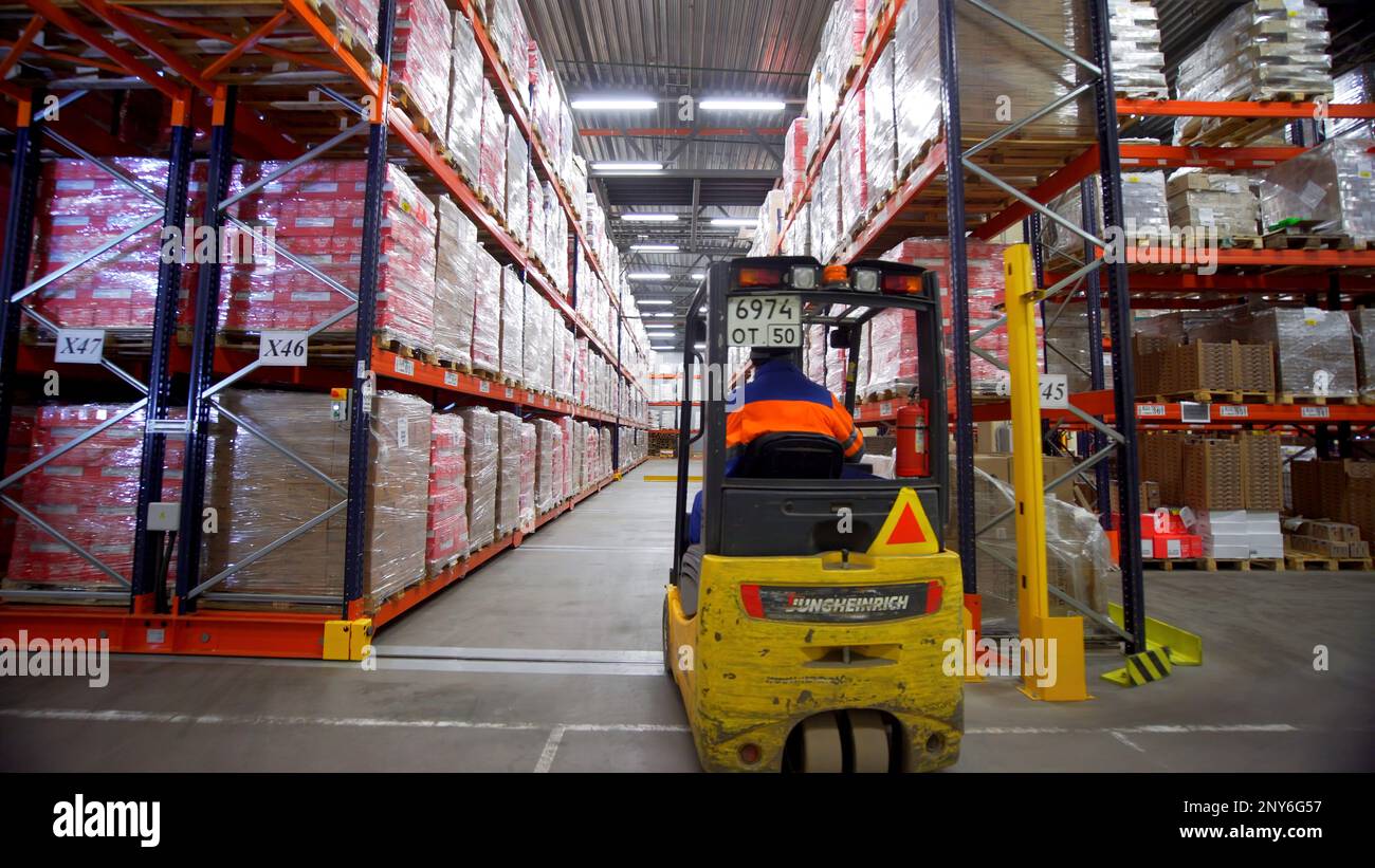 Poland, Warsaw- September 14, 2022: Stacker on large warehouse ...