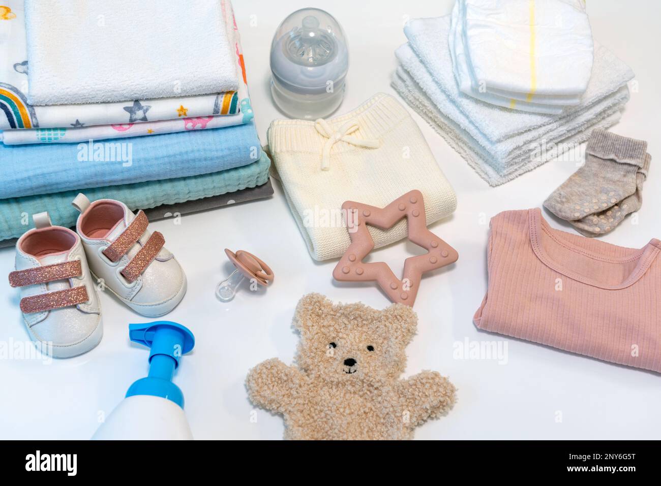 Concept of giving birth. Set of clothes and accessories for newborn on ...