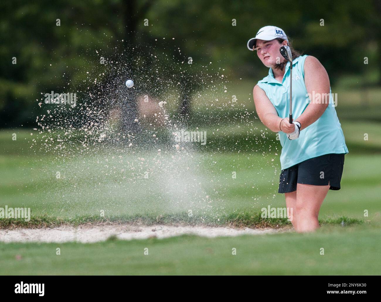 Lexington Christian's Emily Sparks hits out of the sand trap during the ...