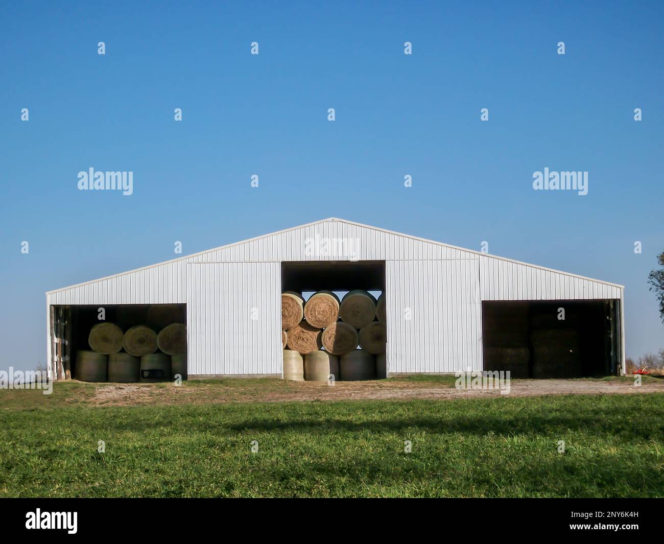 A farmer stacked hay bales hi-res stock photography and images - Alamy
