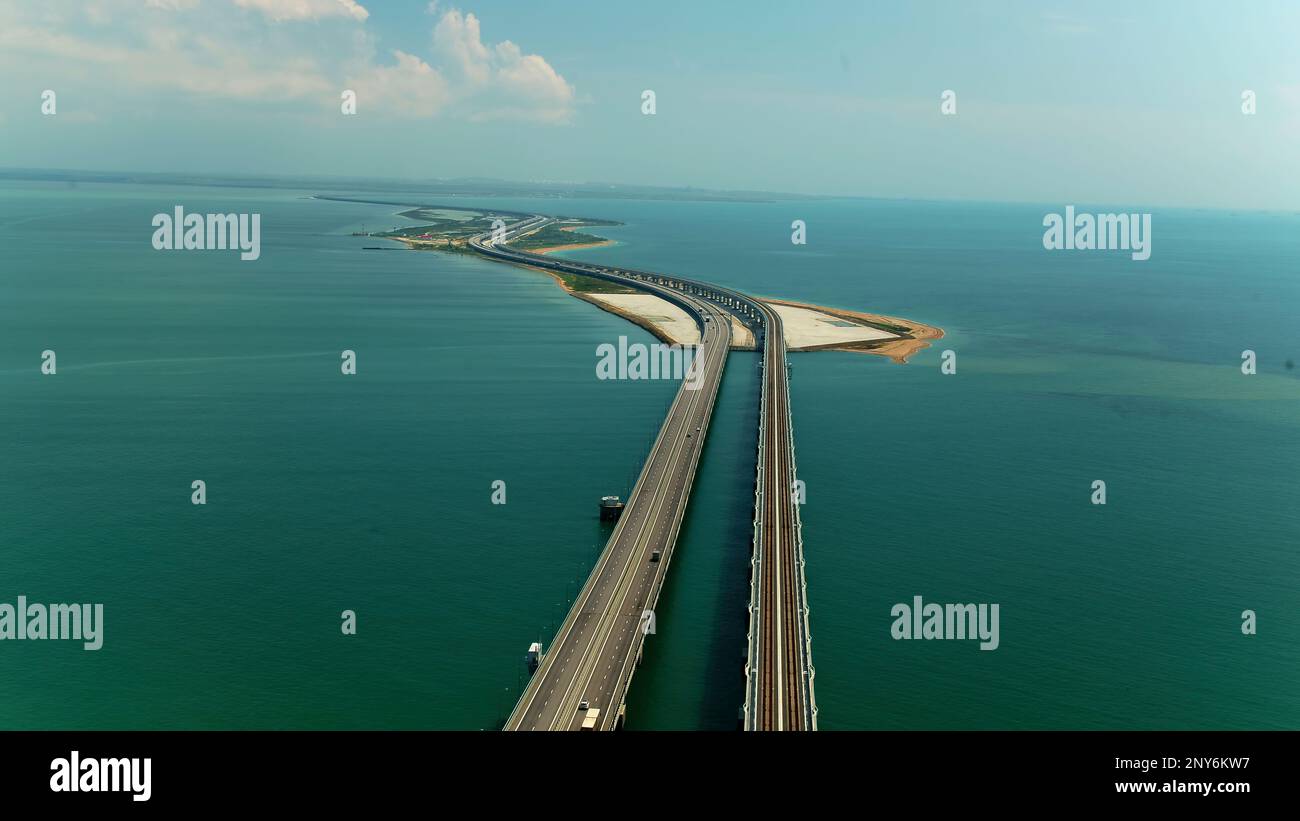 Bird's eye view. Shot.A huge bridge made of white material stretching ...