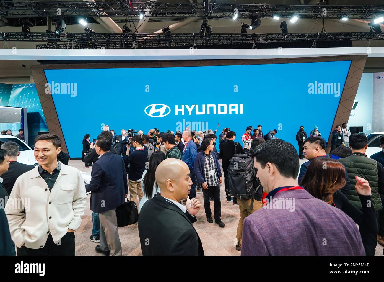 A group of people gathered in front of Hyundai booth after a ...