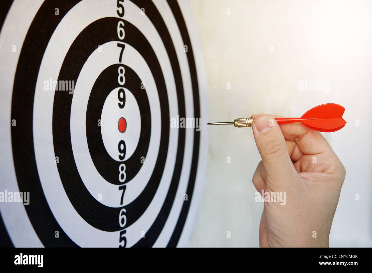 Business education success and target concept. Close up a hand is ...