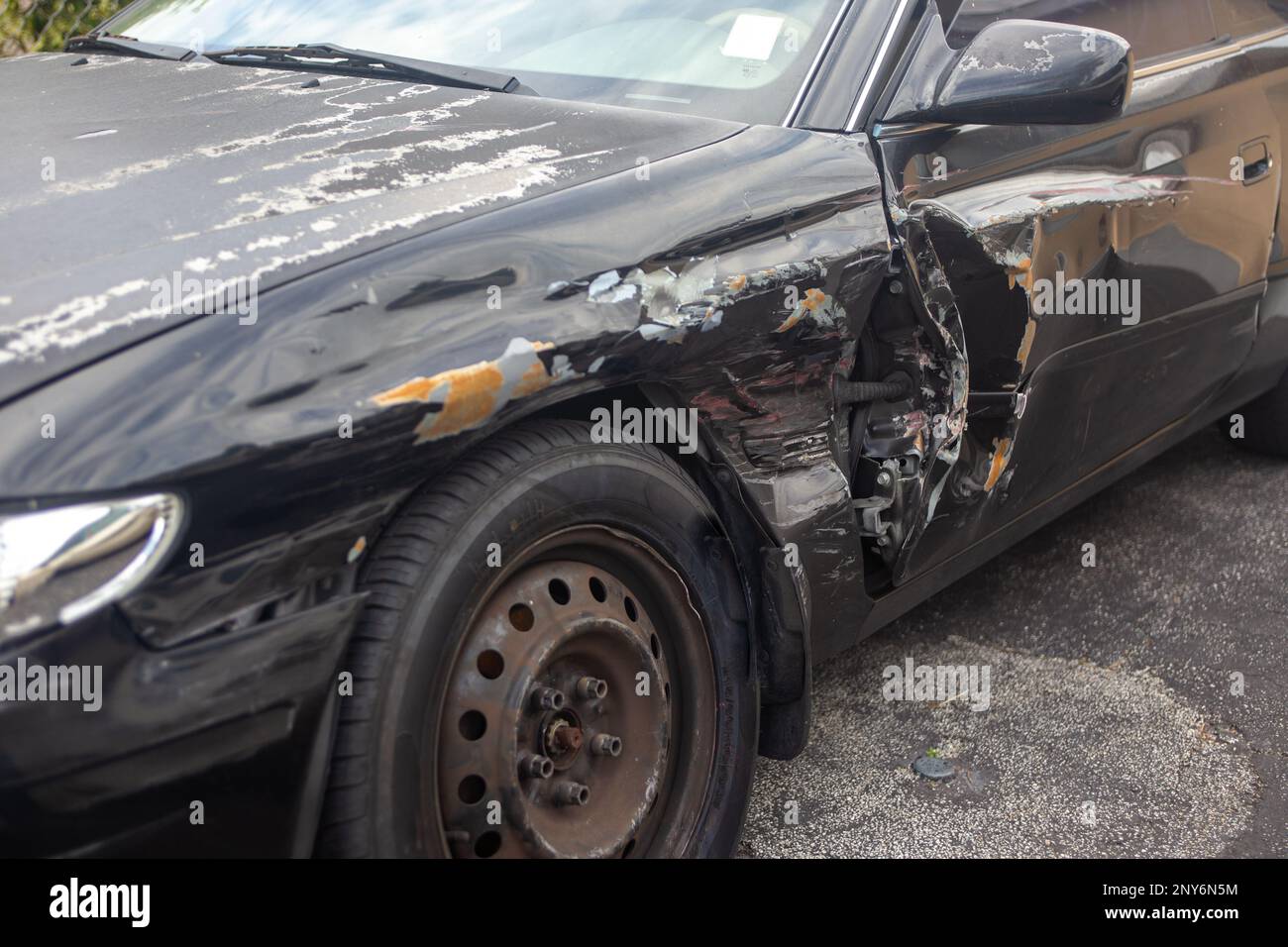 black sedan after front side swipe Stock Photo - Alamy
