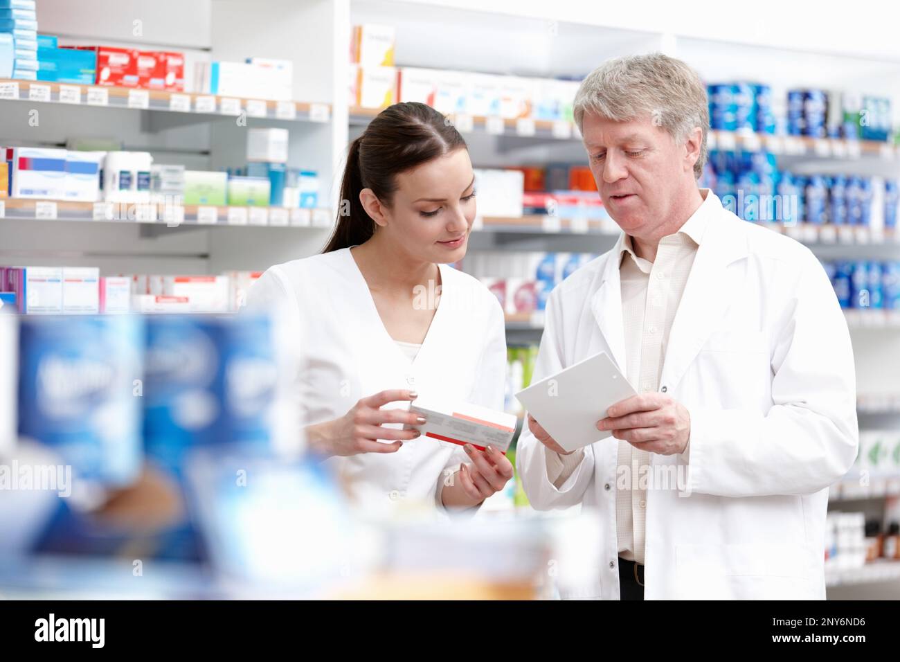 Pharmacists checking the medicine from the prescription. Portrait of ...