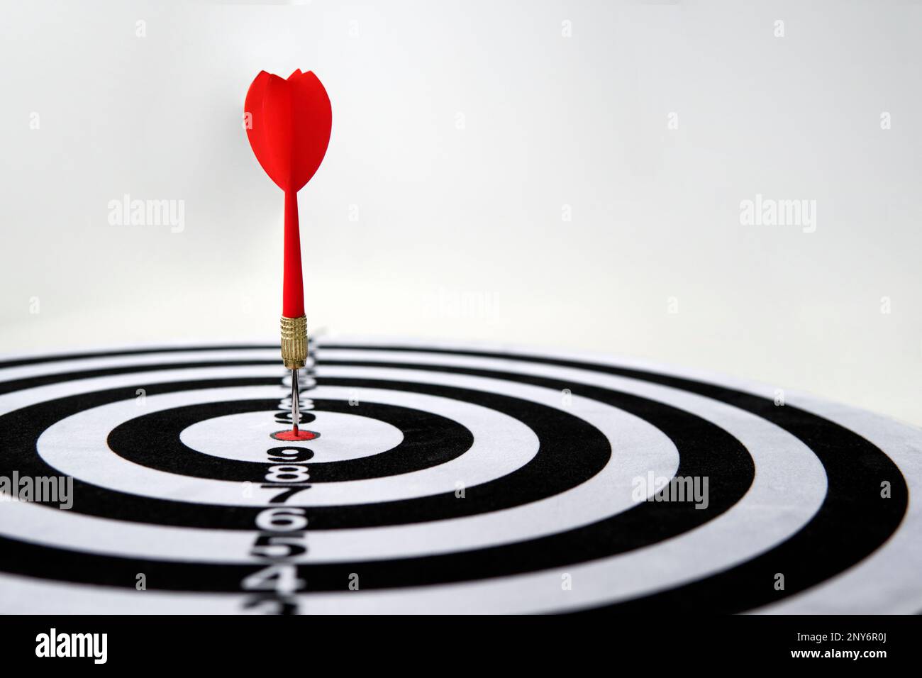 Close red dart on target board right frame. The red dart hit the target ...