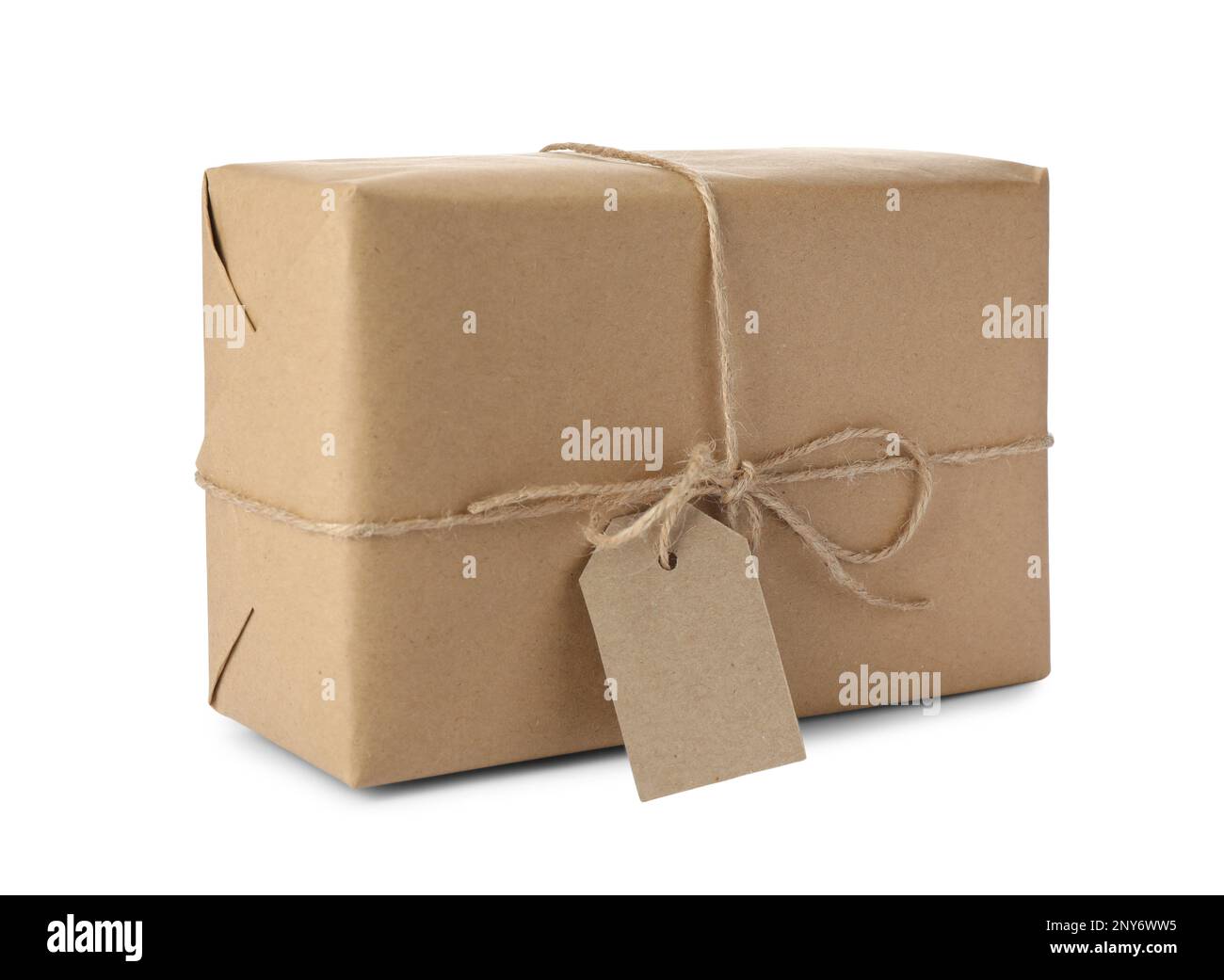 Parcel wrapped in kraft paper with tag on white background Stock Photo ...
