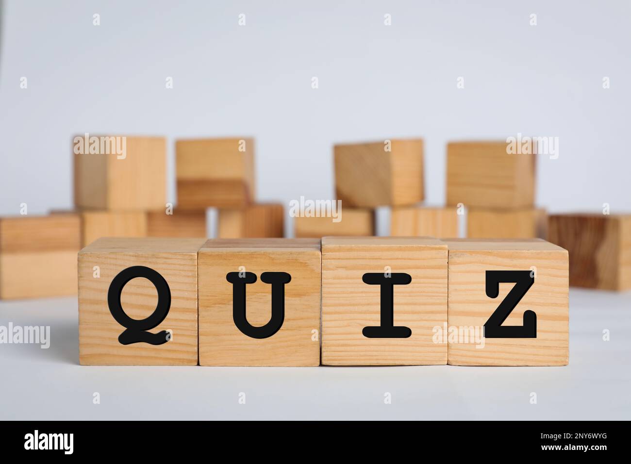 Wooden cubes with word Quiz on white background. Space for text Stock ...