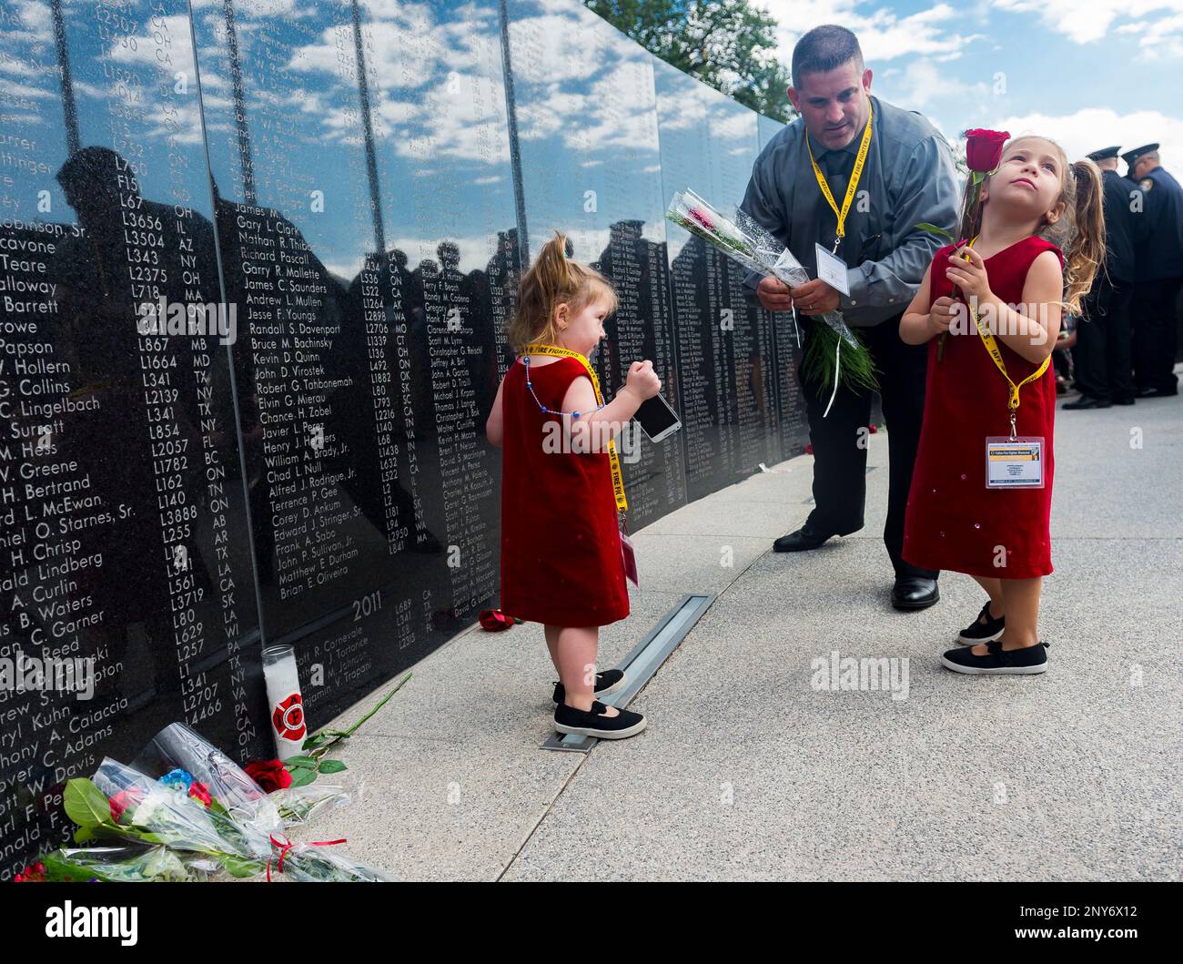 Chad Zinnate, center, of Houston, Texas, helps his daughters, Olivia ...
