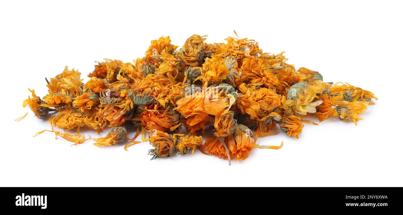 Pile of dry calendula flowers on white background Stock Photo - Alamy