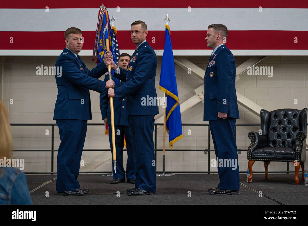 Col. John Poole, 317th Operations Group commander, takes the guidon from Lt. Col. Samuel Dunlap ...