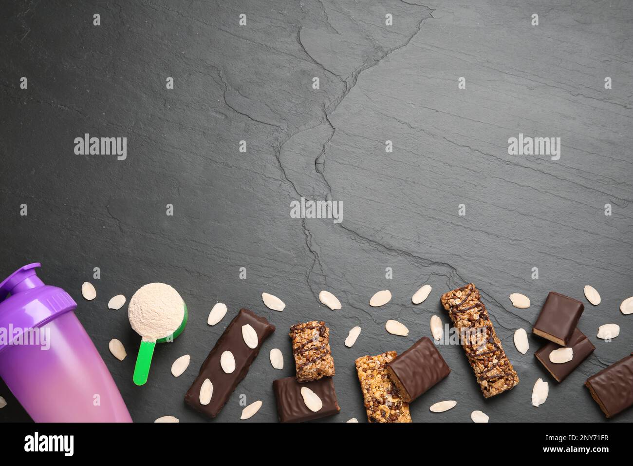 Different energy bars, almond flakes, protein cocktail and powder on ...