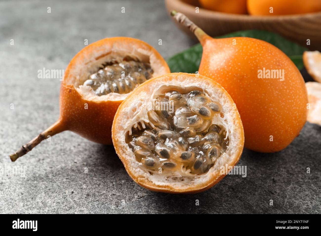 Delicious ripe granadillas on grey table, closeup Stock Photo - Alamy