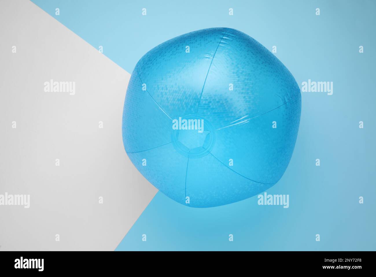 Light blue beach ball on color background, top view Stock Photo - Alamy
