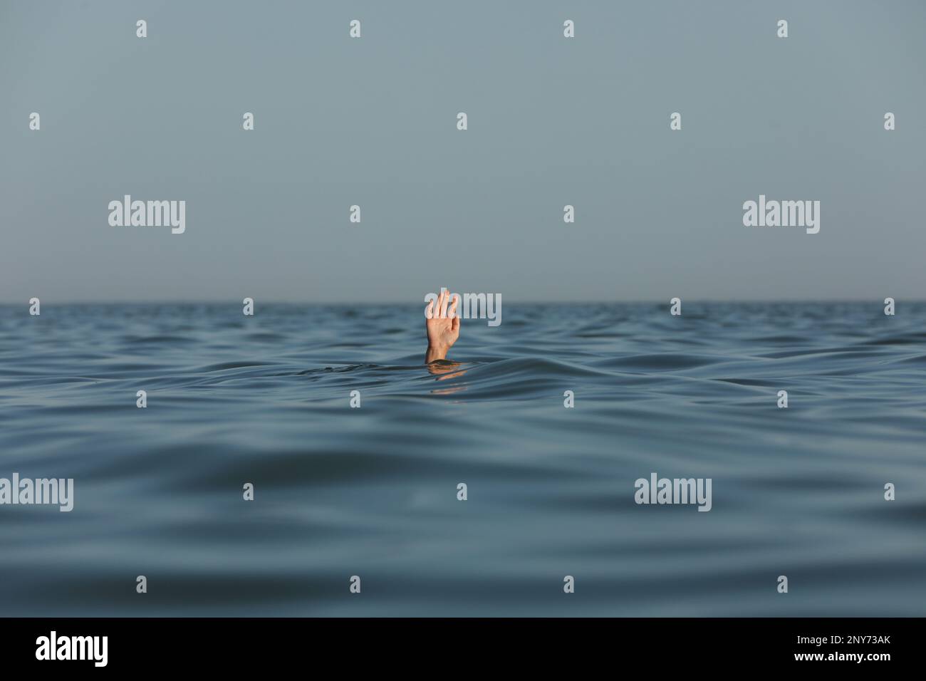 Drowning woman reaching for help in sea Stock Photo - Alamy