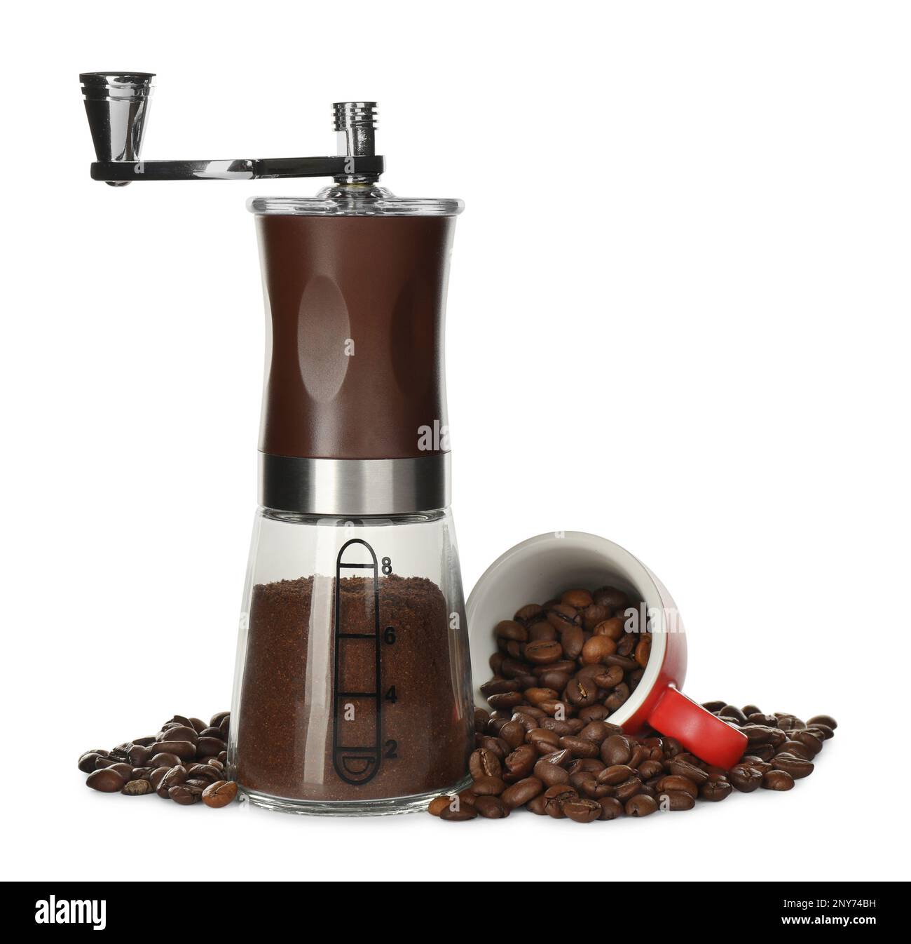 Modern manual coffee grinder with powder, beans and cup on white ...